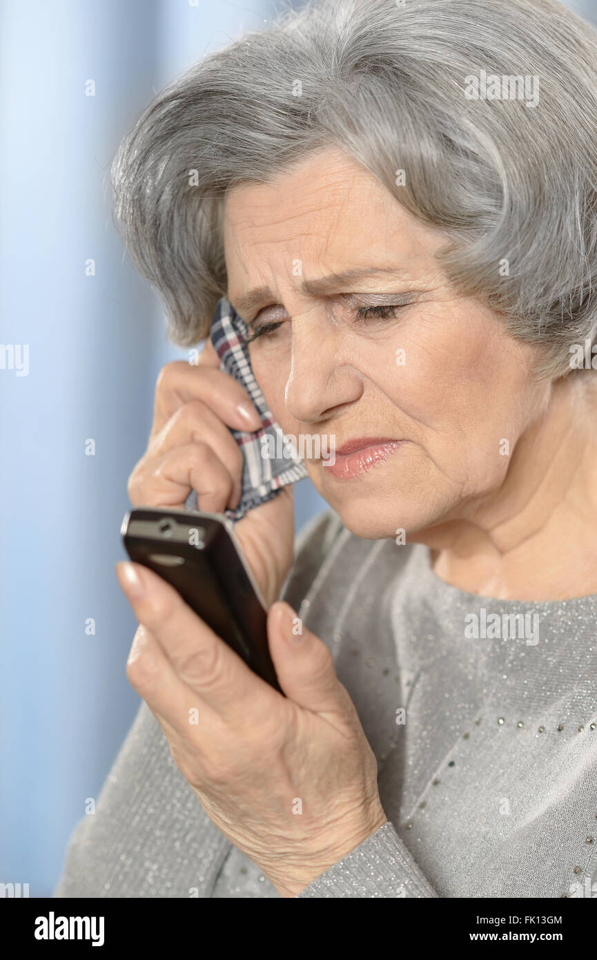 Mature woman calling doctor Stock Photo - Alamy