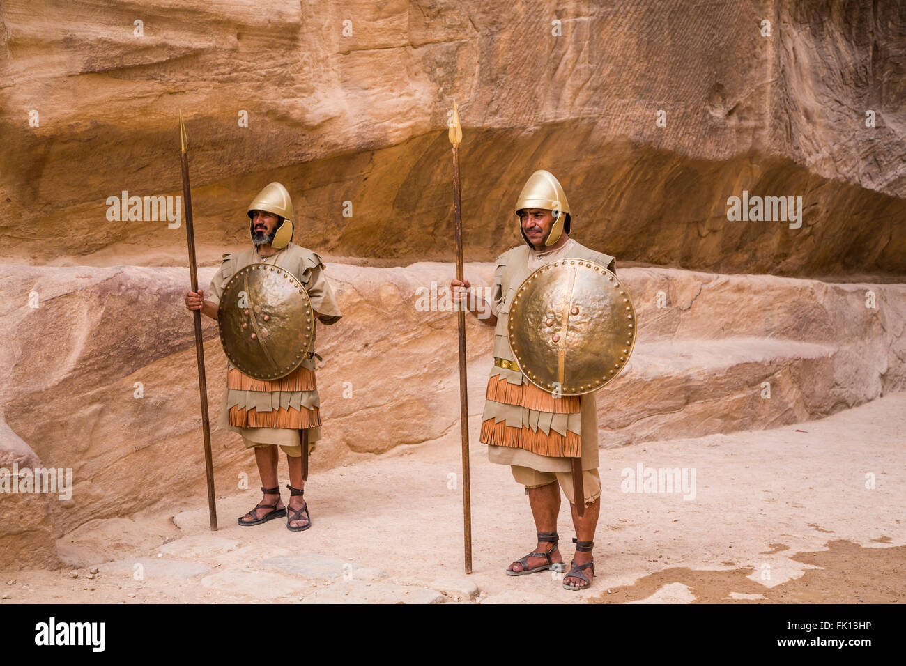 Two ancient guards in period dress guard the Siq entrance to Petra ...