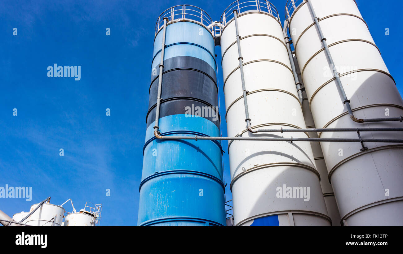 The Cement factory and related blue silos Stock Photo - Alamy