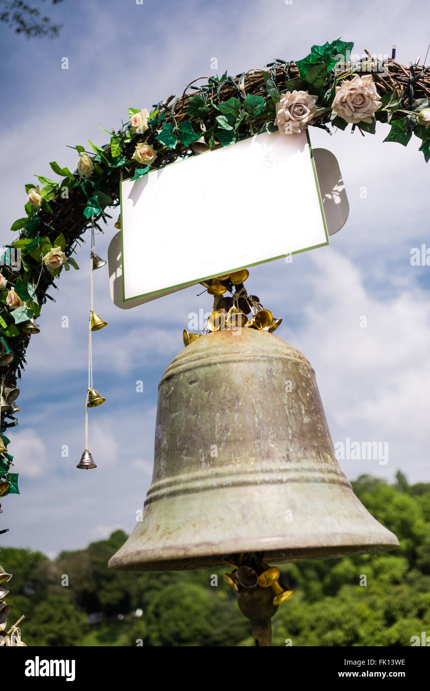 Old wedding bell with pretty flower decoration. Wedding and celebratory ...