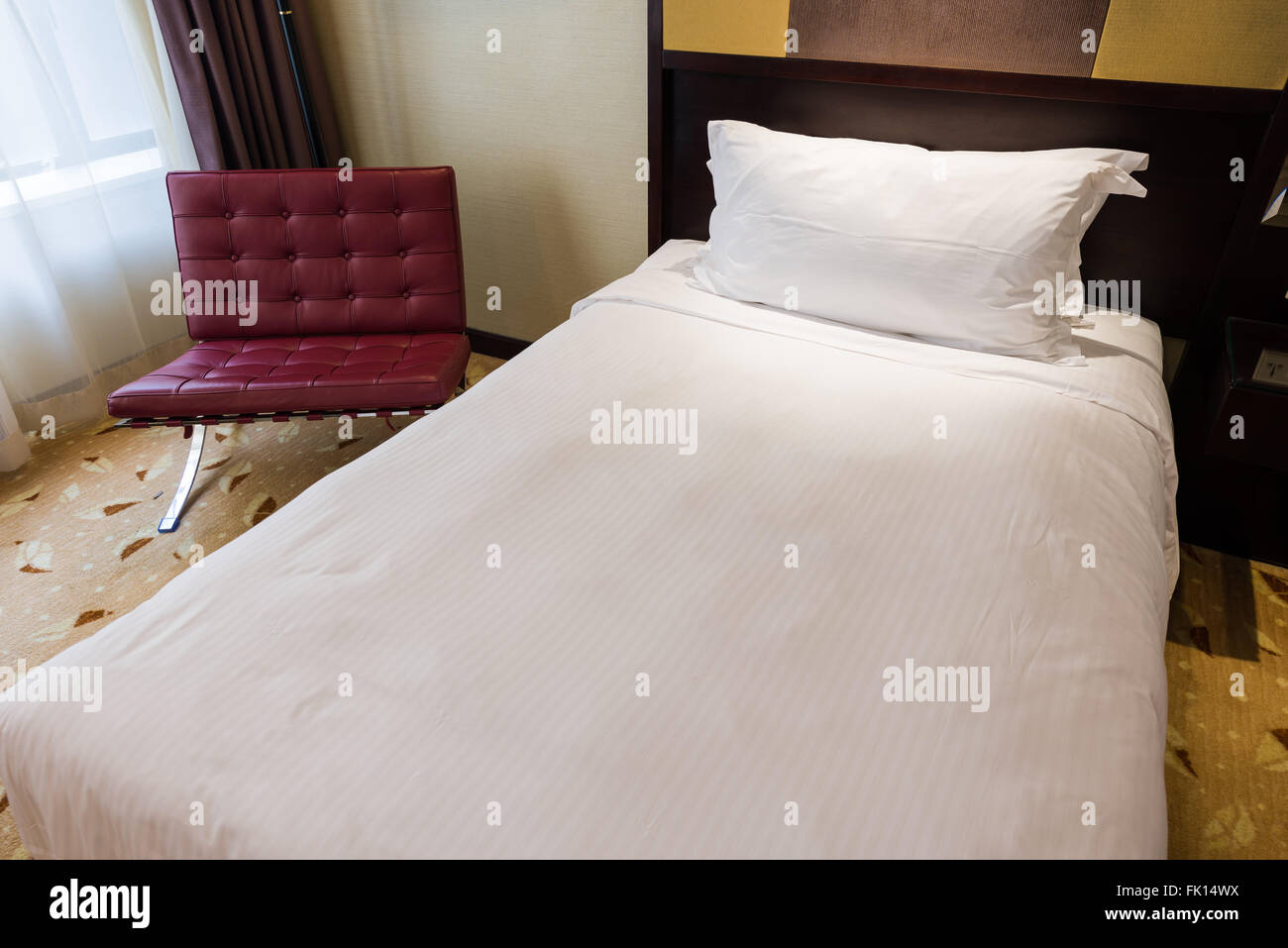 Clean and neat bed. Solo travel concepts Stock Photo - Alamy
