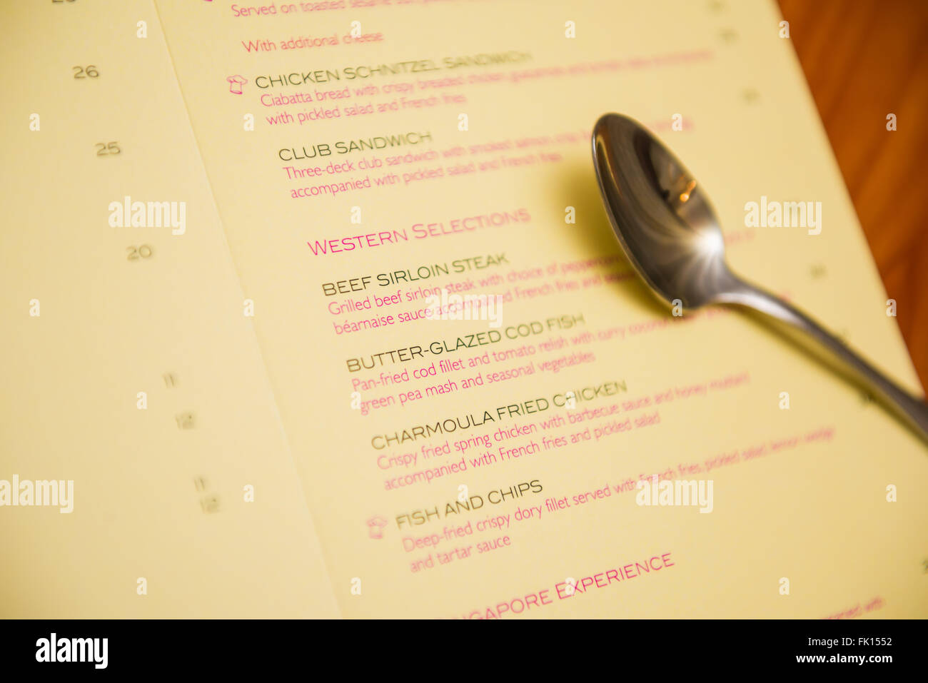 Metal spoon on food menu. Focus on Western dishes Stock Photo - Alamy