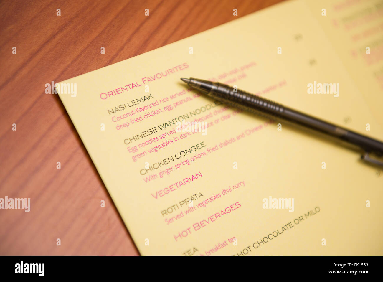 Pen on food menu. Focus on local dishes Stock Photo - Alamy