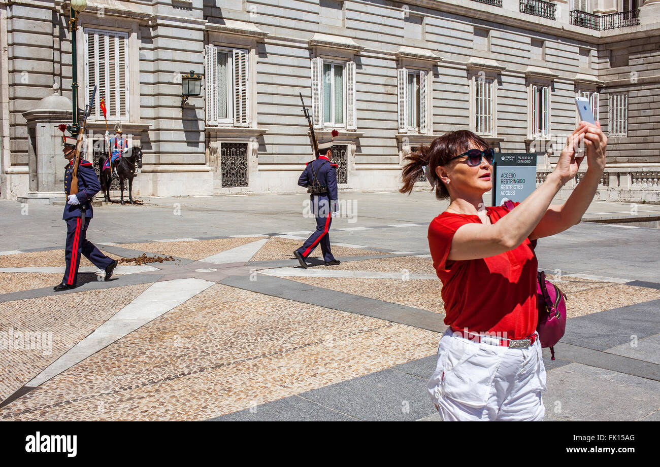 Tourist and Changing of the Guard, Royal Palace, Madrid, Spain Stock ...