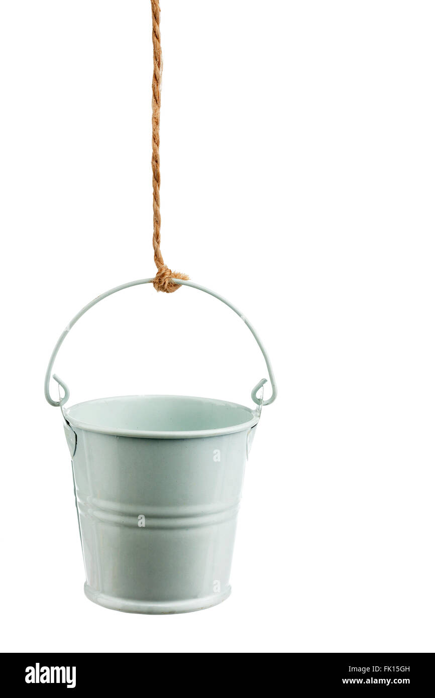 Iron bucket on a rope, isolated on white background Stock Photo - Alamy