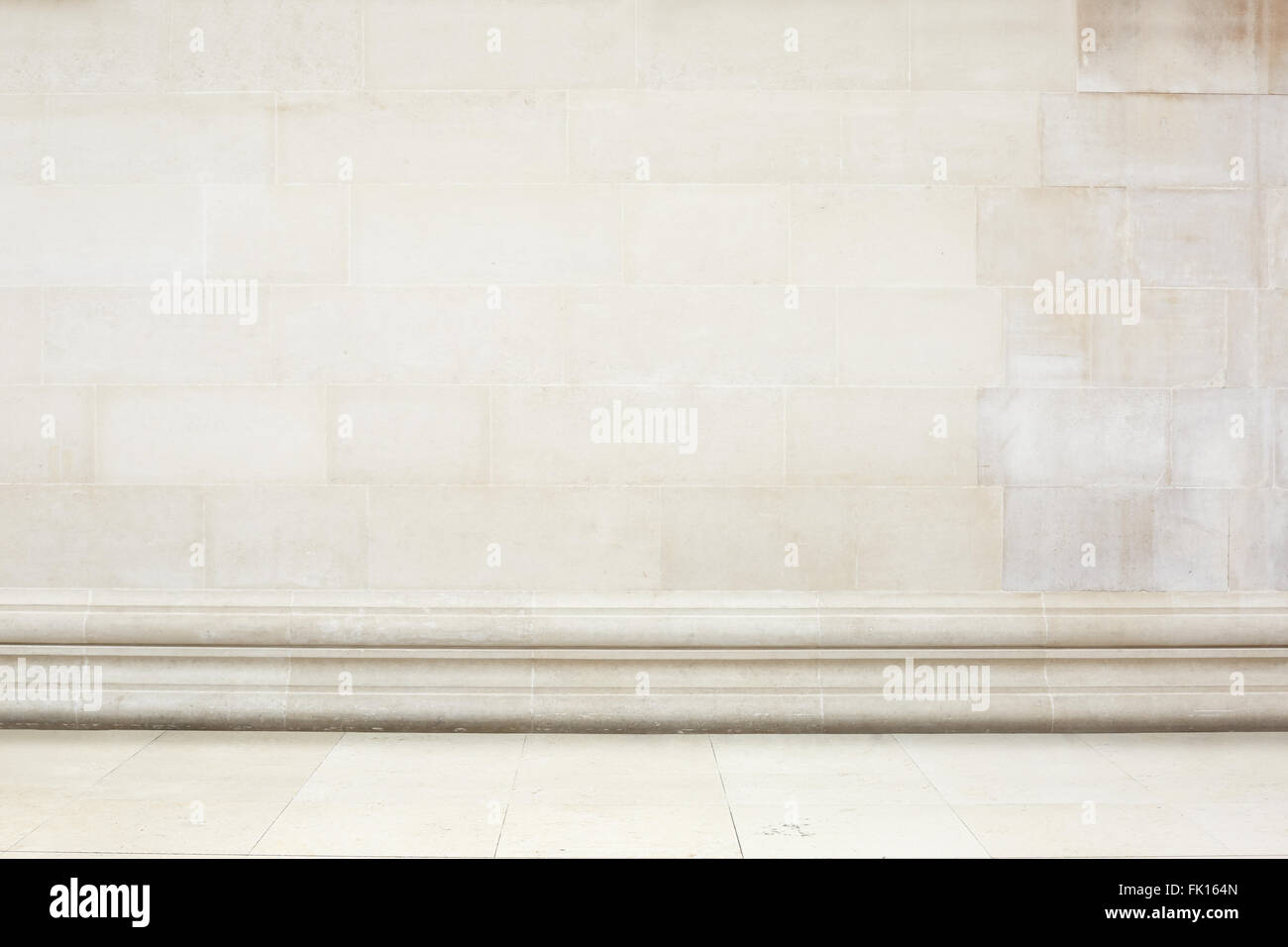 Beige stone tiled wall and floor with decoration border Stock Photo - Alamy