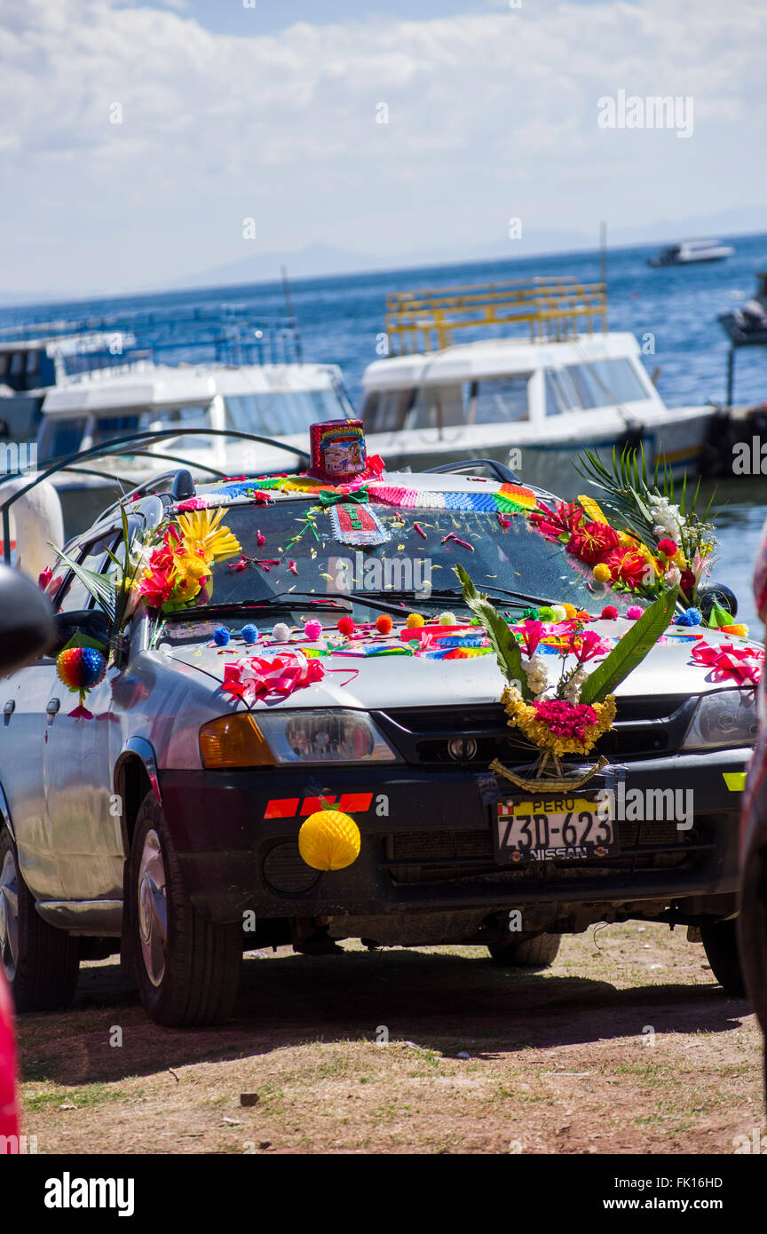 A car adorned with symbolic decorations after being blessed by a priest ...
