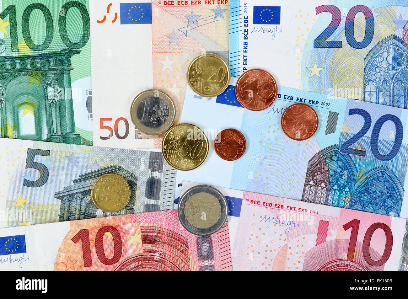 Image of various denominations of banknotes and coins of euro currency ...