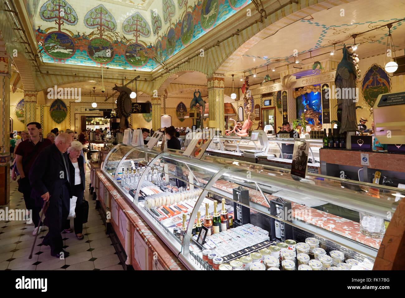 Harrods department store interior, food area with people in London ...