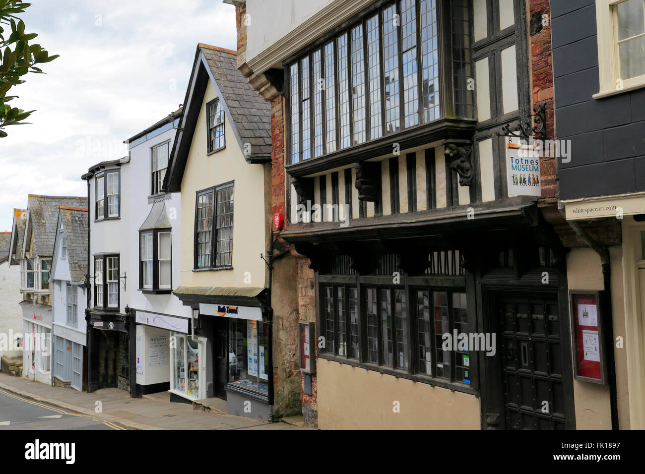 Ornate buildings on High street, Totnes Market town, Devon County ...