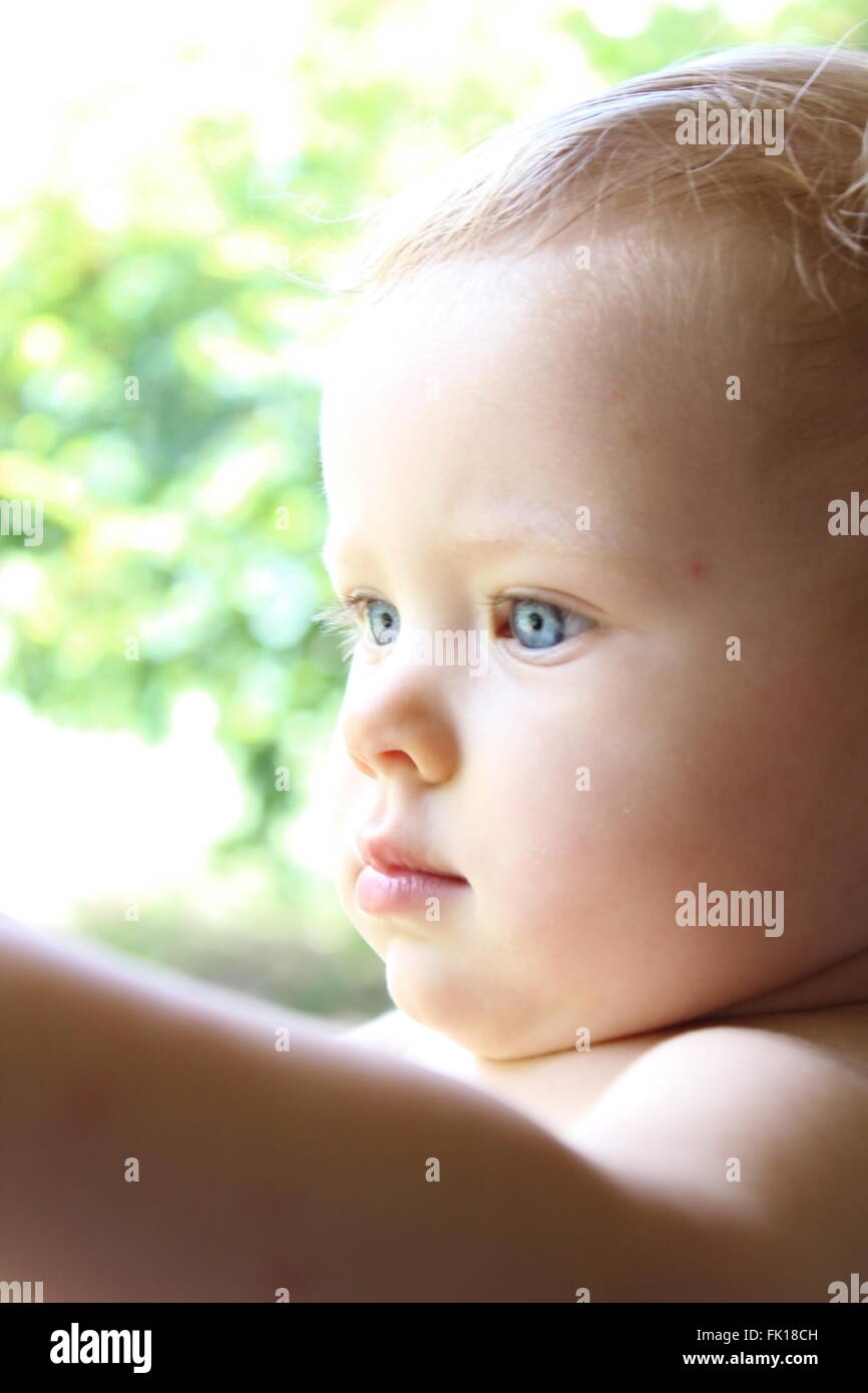 Baby looking out window hi-res stock photography and images - Alamy