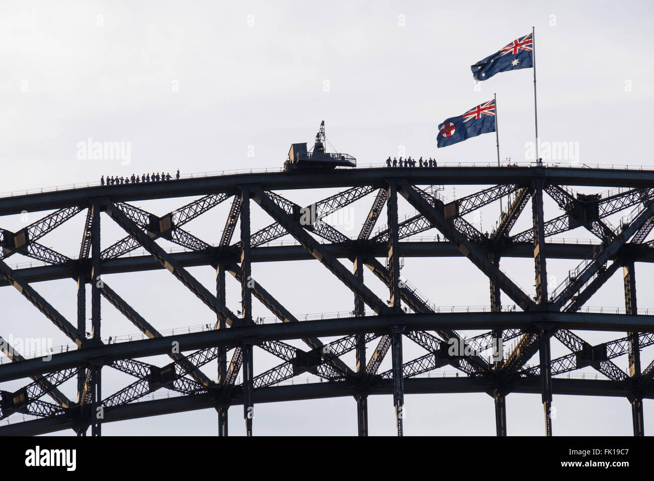People standing at the top of the Sydney Harbour Bridge following their ...