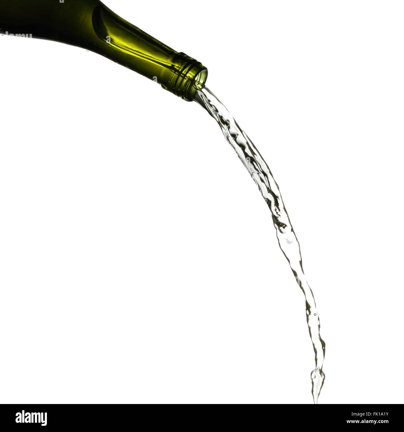 White wine pouring isolated on white background Stock Photo - Alamy
