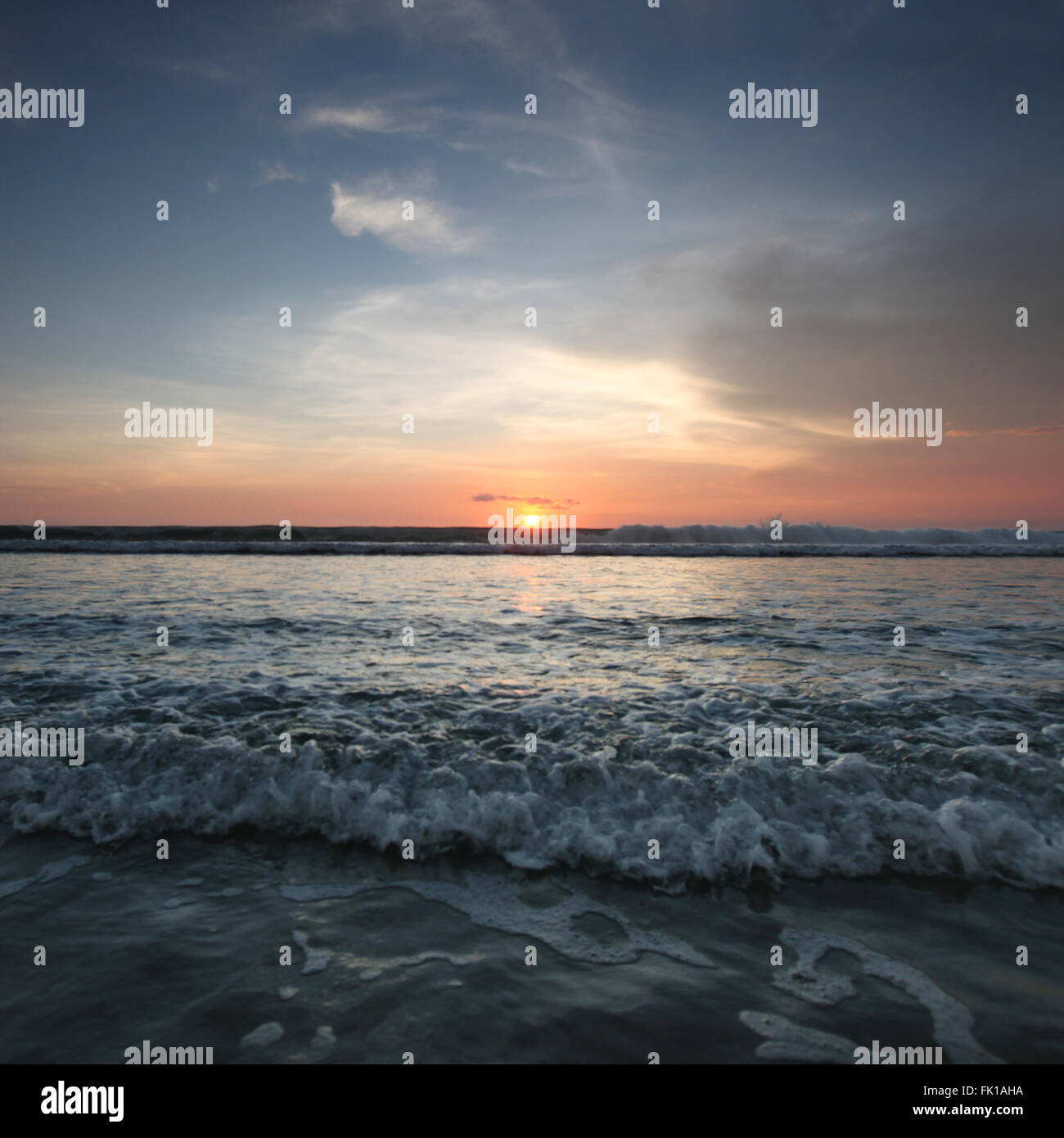 Radiant sea beach sunset on Bali Stock Photo - Alamy