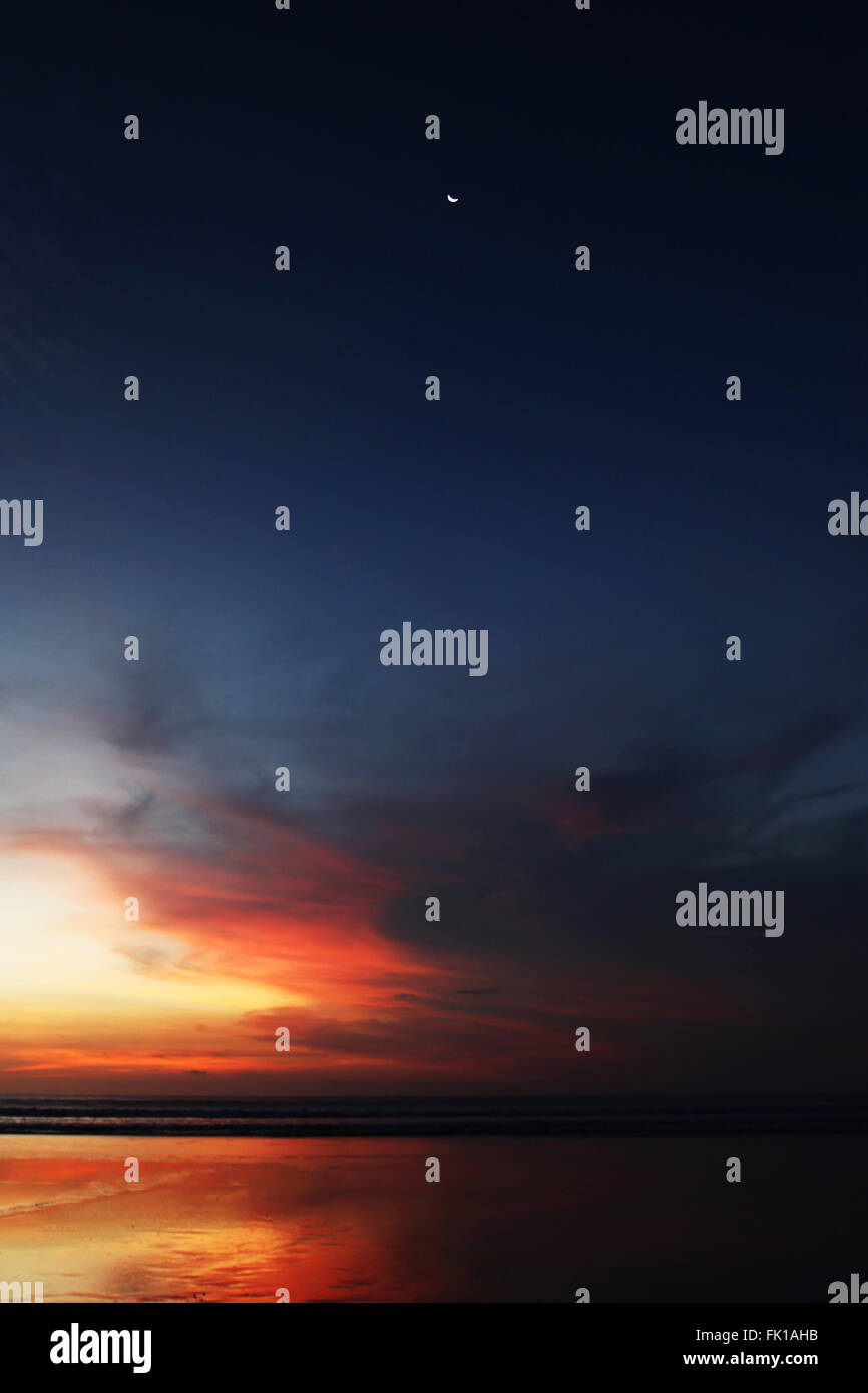 Radiant sea beach sunset on Bali Stock Photo - Alamy