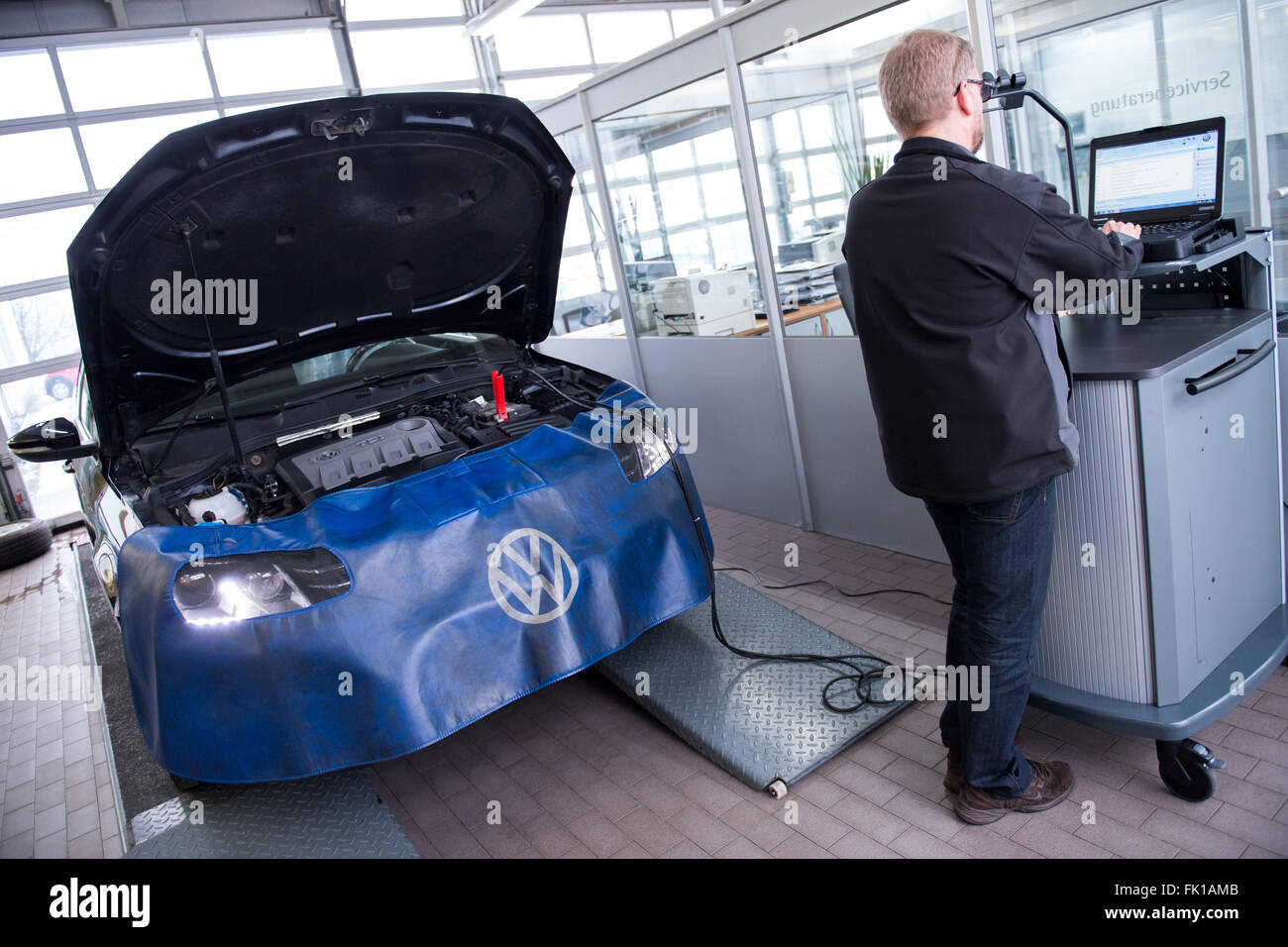 Car repair shop manager Marc Oliver Dahl has connected a VW Passat TDI ...