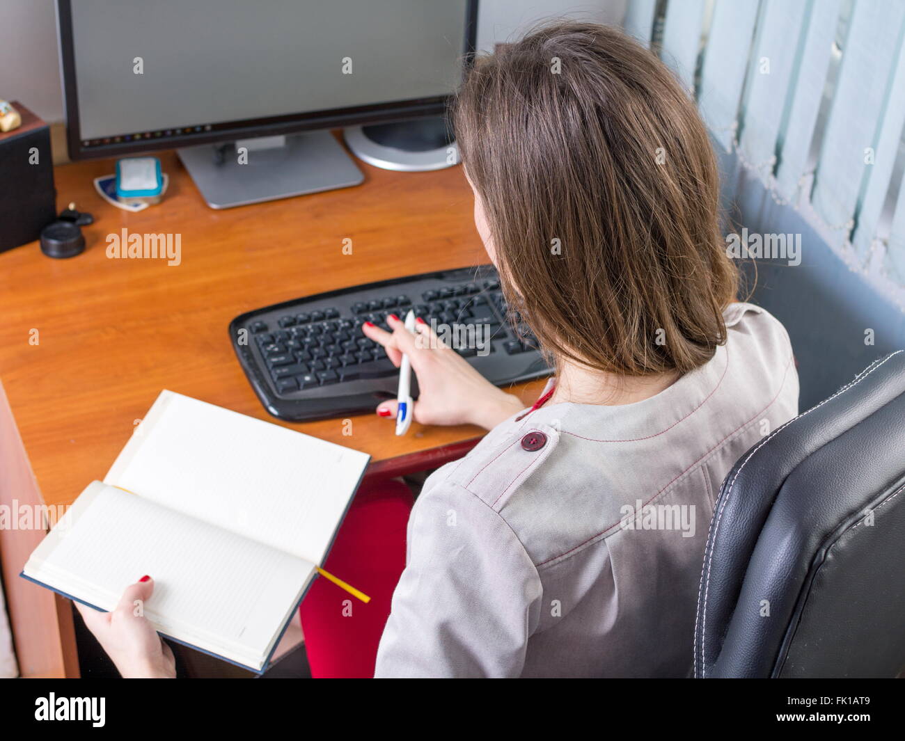Young businesswoman working at the computer Stock Photo - Alamy