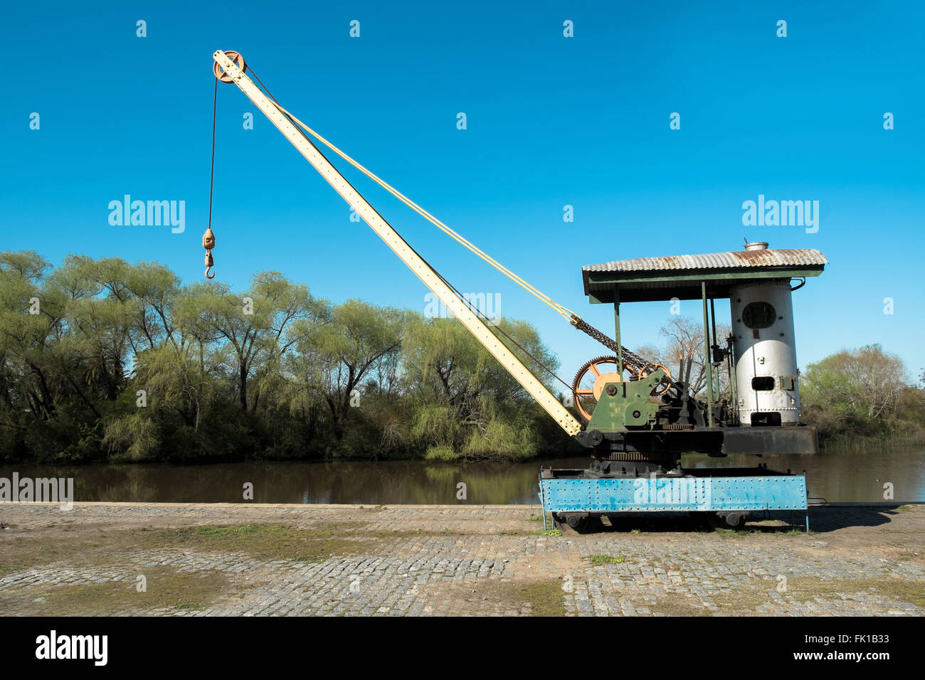 Crane on a riverside harbor Stock Photo - Alamy
