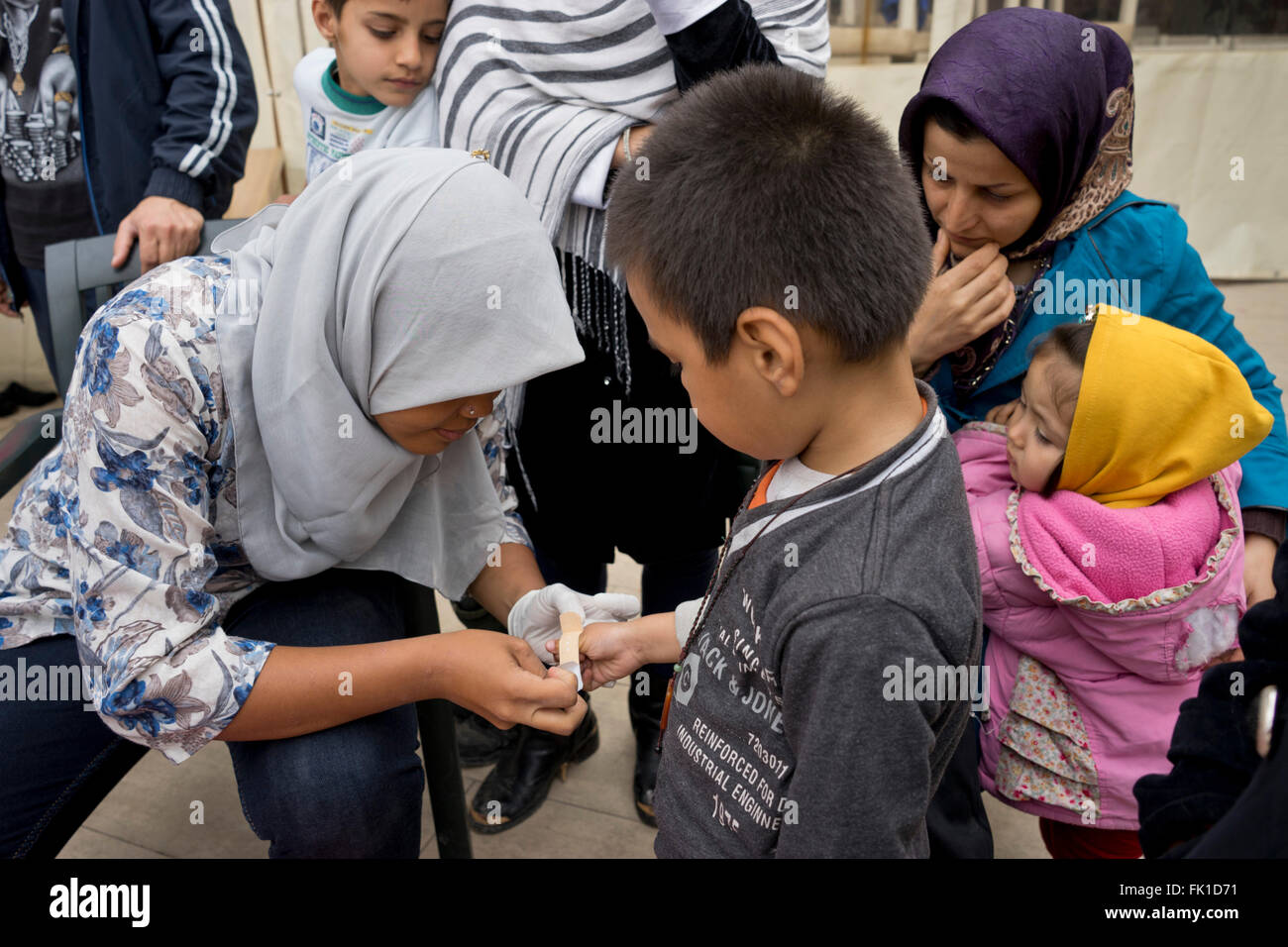Volunteer doctor treating refugees from Syrian and Afghnanistan in ...