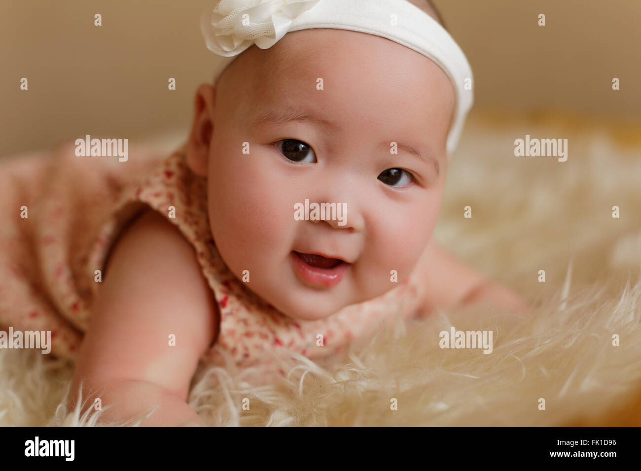 pretty little baby girl on fur Stock Photo - Alamy