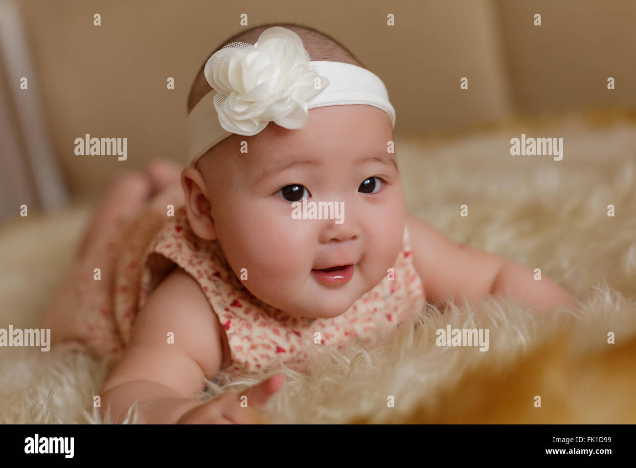 pretty little baby girl on fur Stock Photo - Alamy