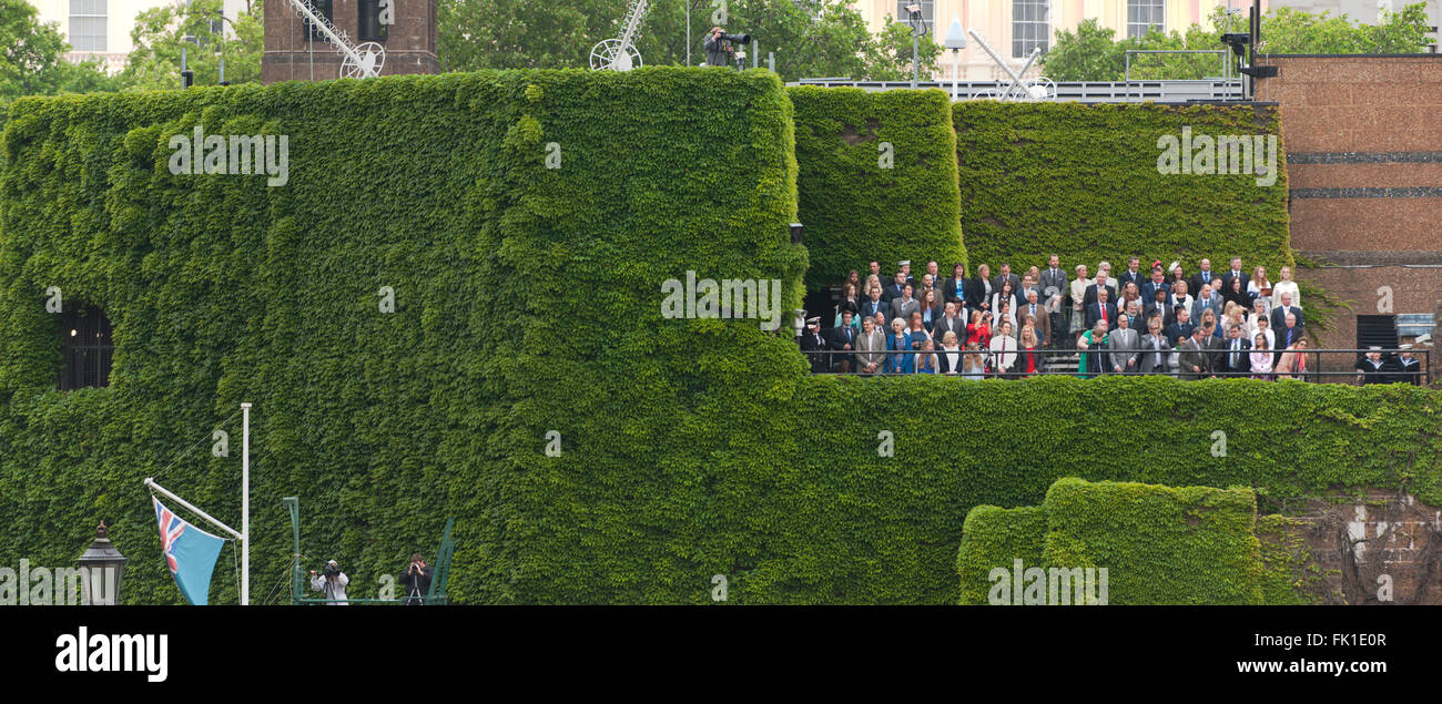 Spectators watch Trooping the Colour ceremony from the ivy covered ...