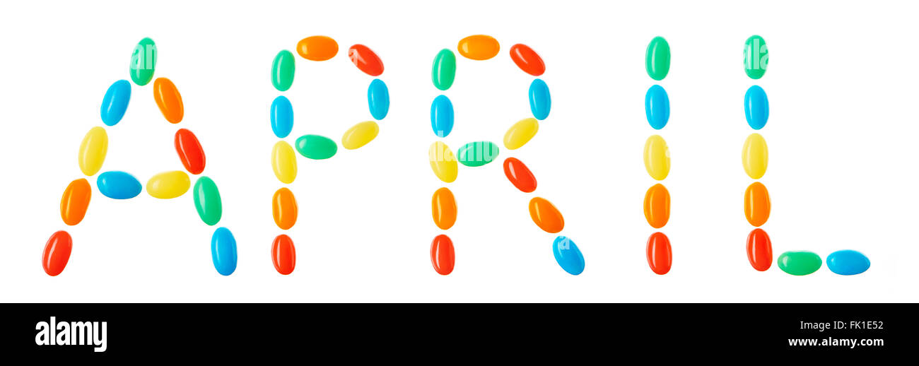 "april" lettering made of multicolored candies isolated on white ...