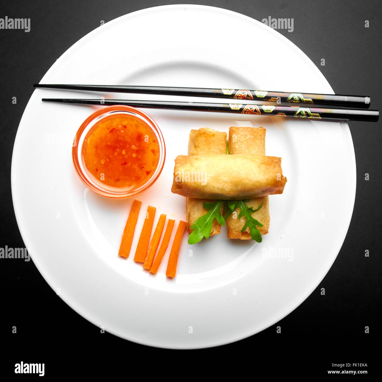 Spring rolls with chopsticks and sweet chilli dipping sauce Stock Photo ...