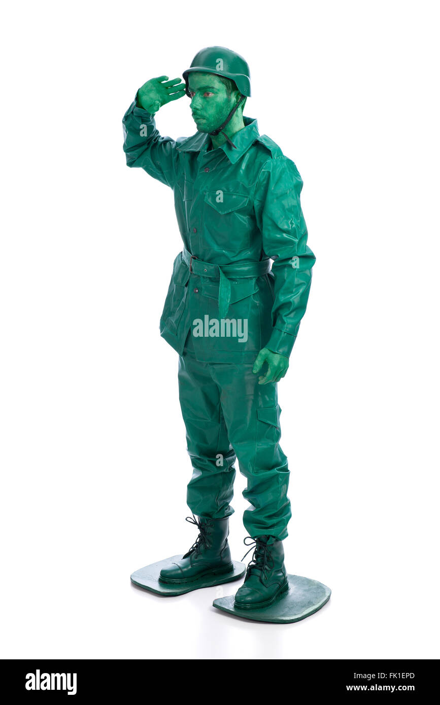 Man on a green toy soldier costume saluting isolated on white ...