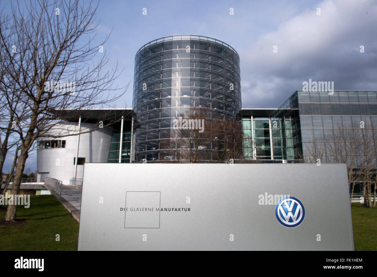 A VW logo seen on a sign in front of the Transparent Factory of German ...