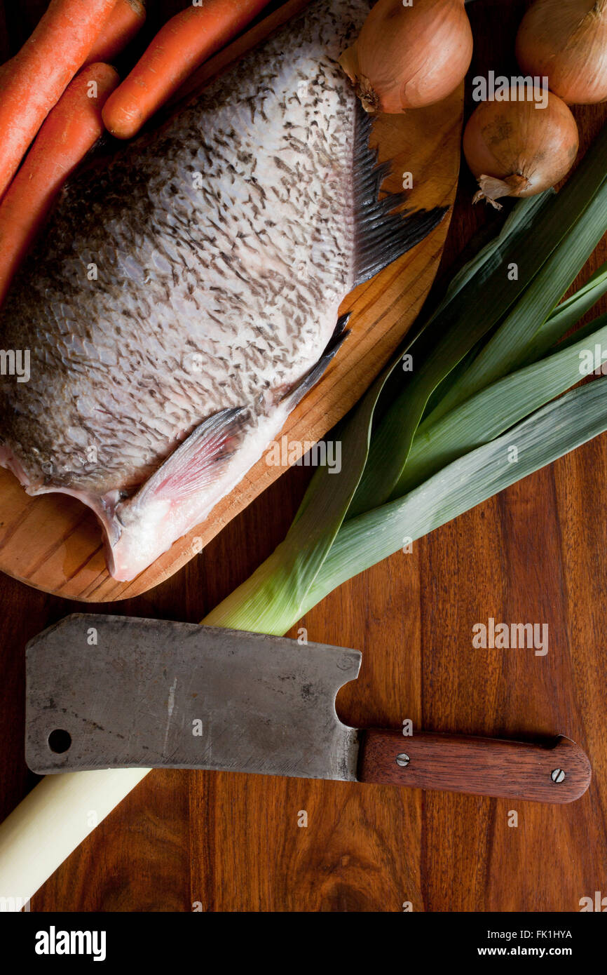 Fresh raw fish on wooden cutting board Stock Photo - Alamy