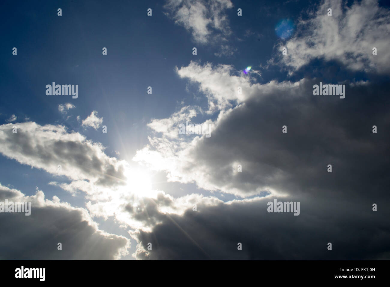The rays of the sun passing through the clouds on blue sky Stock Photo - Alamy