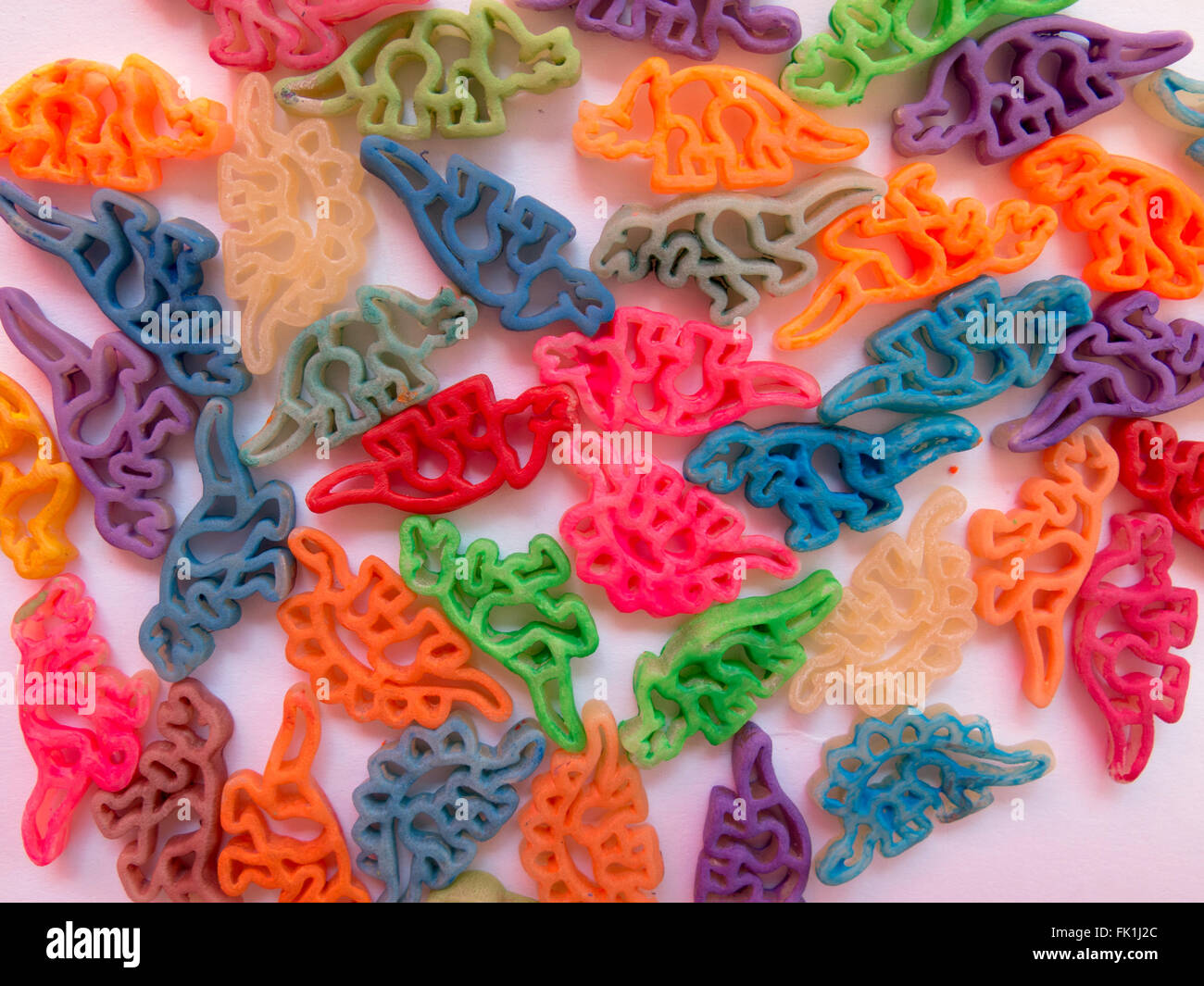 colored dinosaurs closeup on white background Stock Photo - Alamy