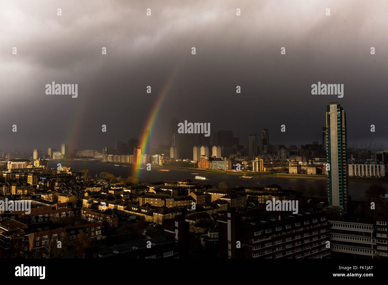 London, UK. 5th March, 2016. UK Weather: Colourful rainbow breaks ...