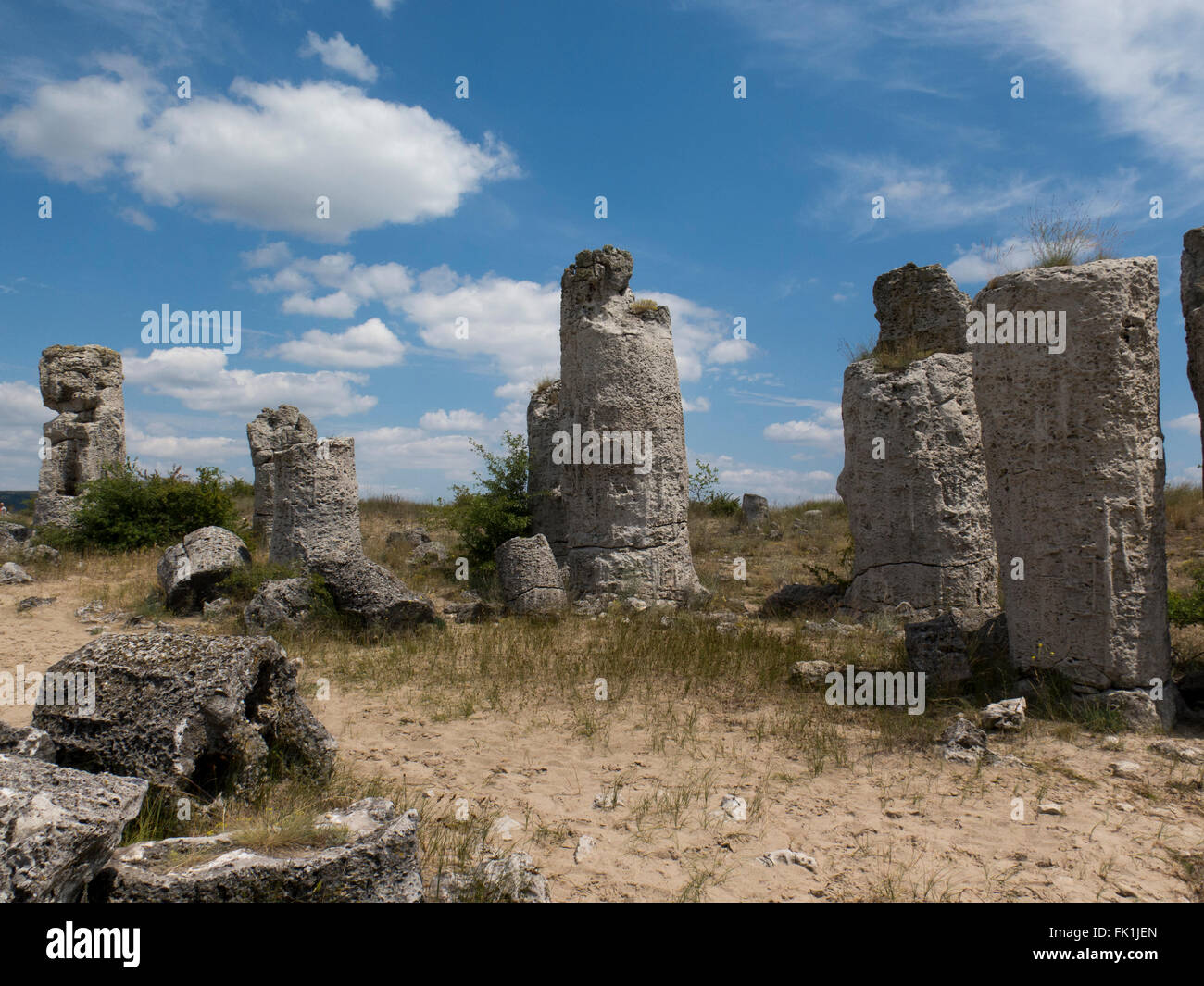 Stone pillars on the background of blue sky Stock Photo - Alamy