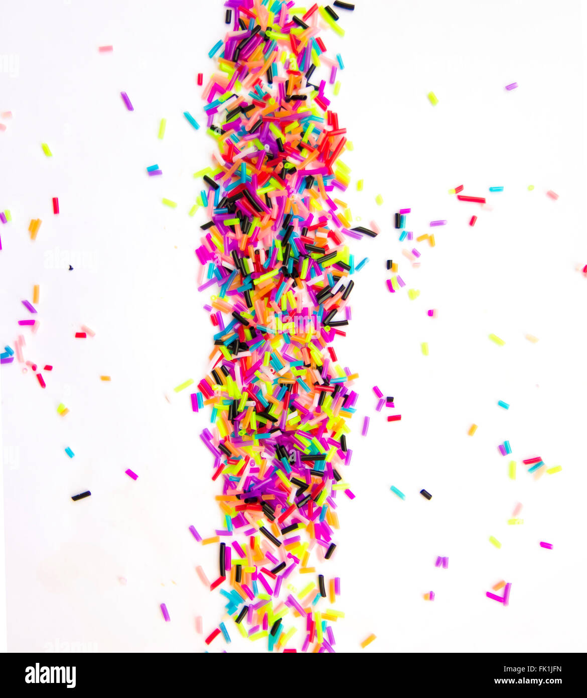 lots of colorful confetti on white background Stock Photo - Alamy