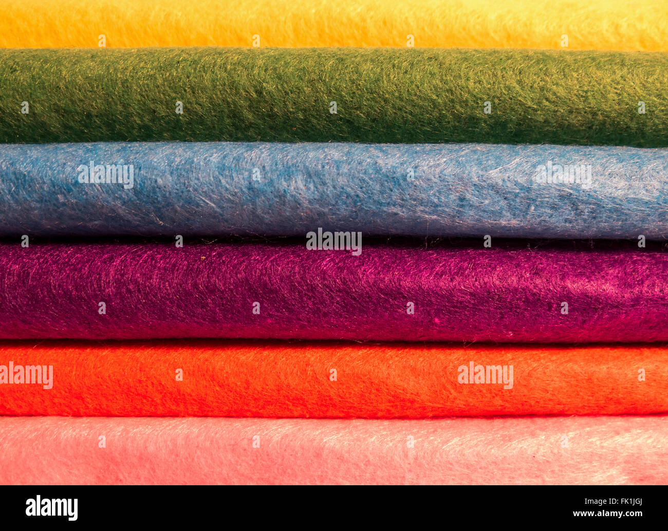 Felt of different colors, folded on each other, forming a colored line ...