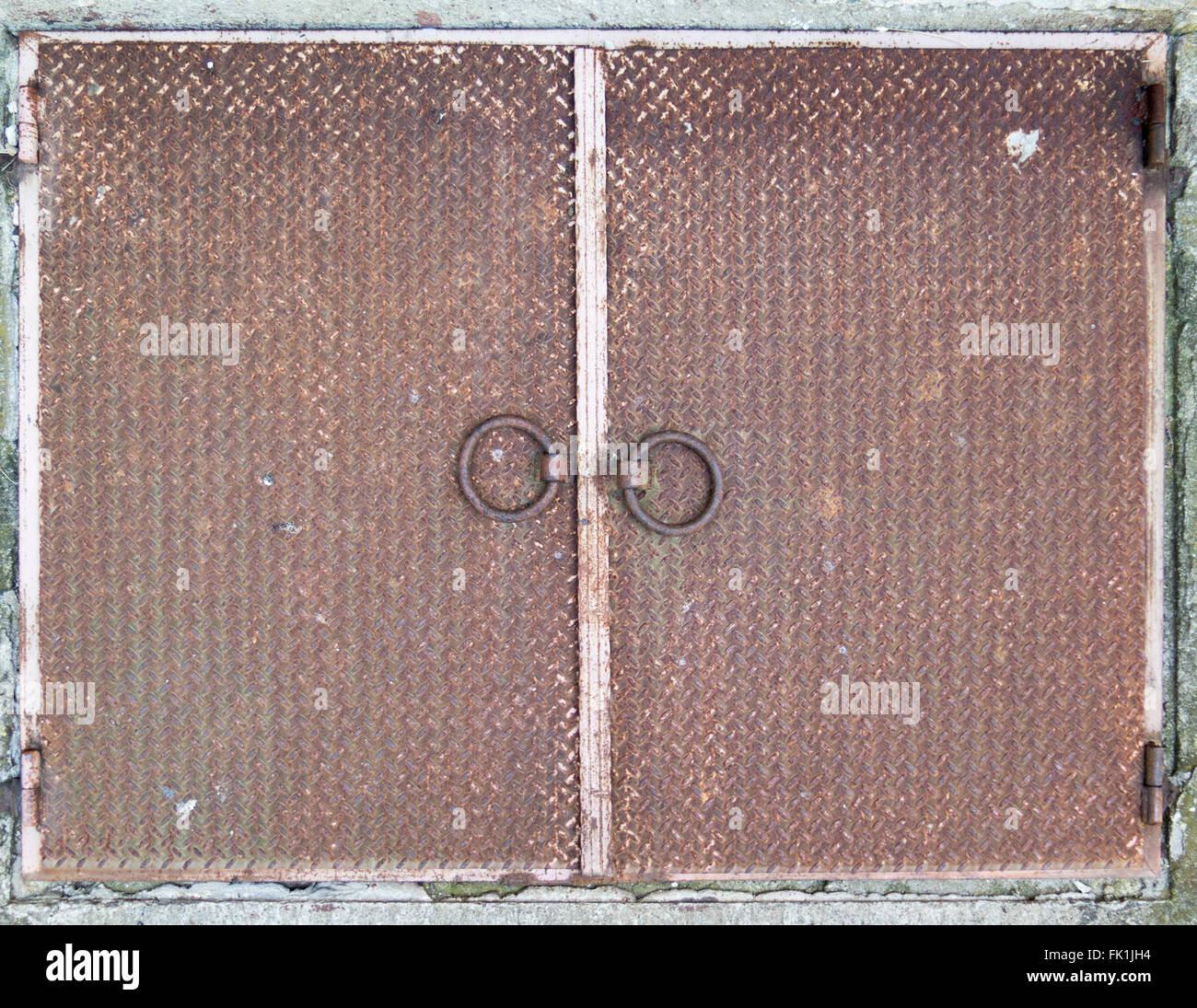 rusty iron door with round handles,stone wall Stock Photo - Alamy
