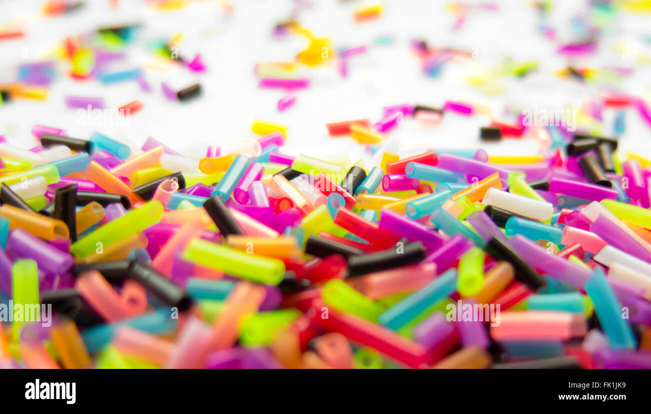 Background of colorful small elements, tubes, beads Stock Photo - Alamy