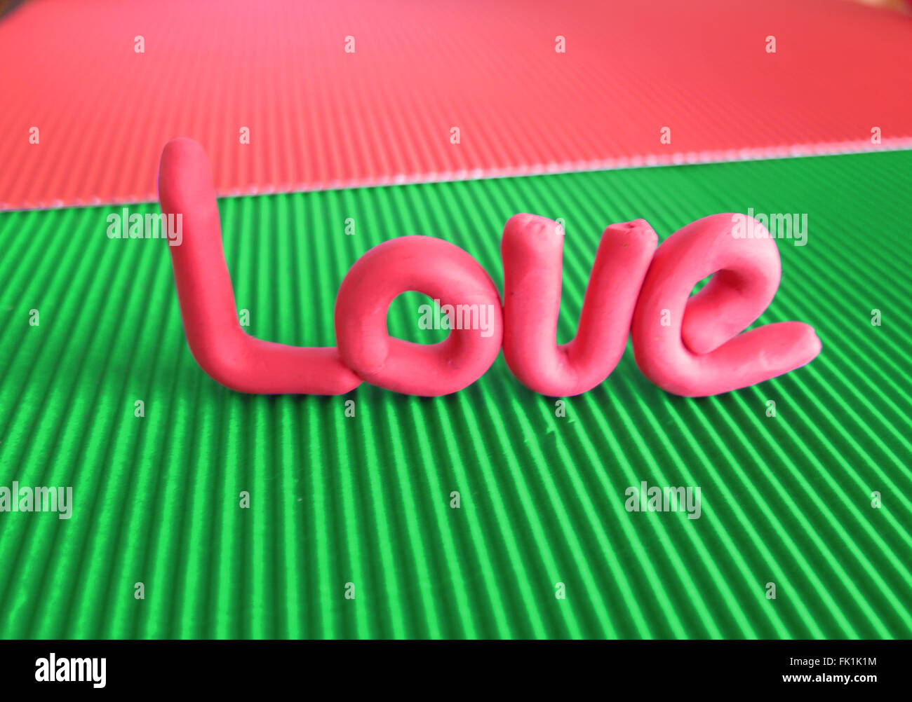 The word Love on colourful textured paper Stock Photo - Alamy