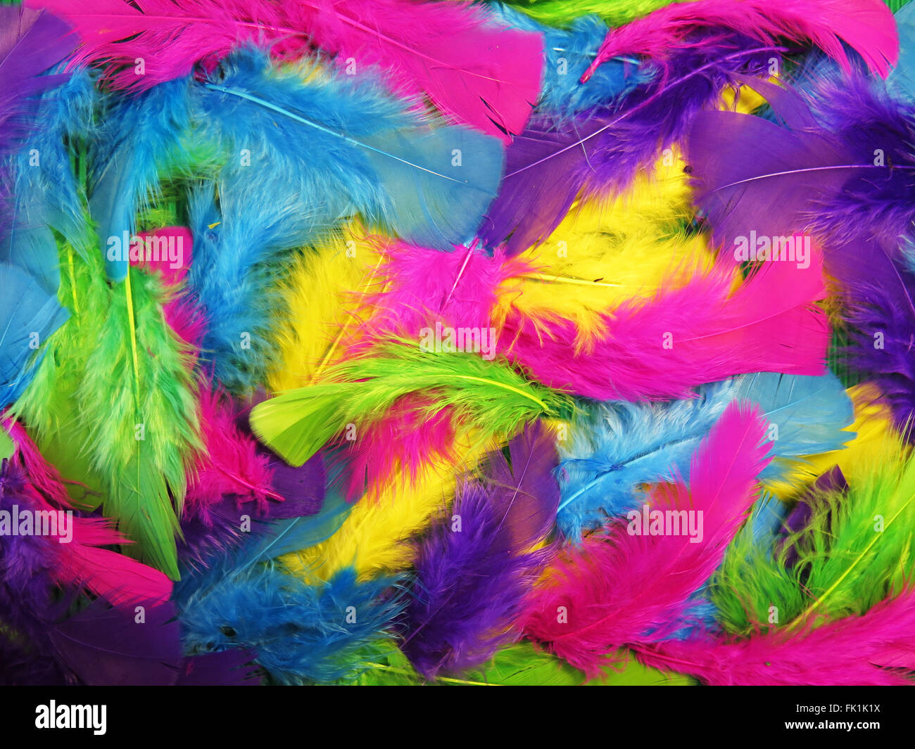 Many colored soft feathers. Texture. background Stock Photo - Alamy