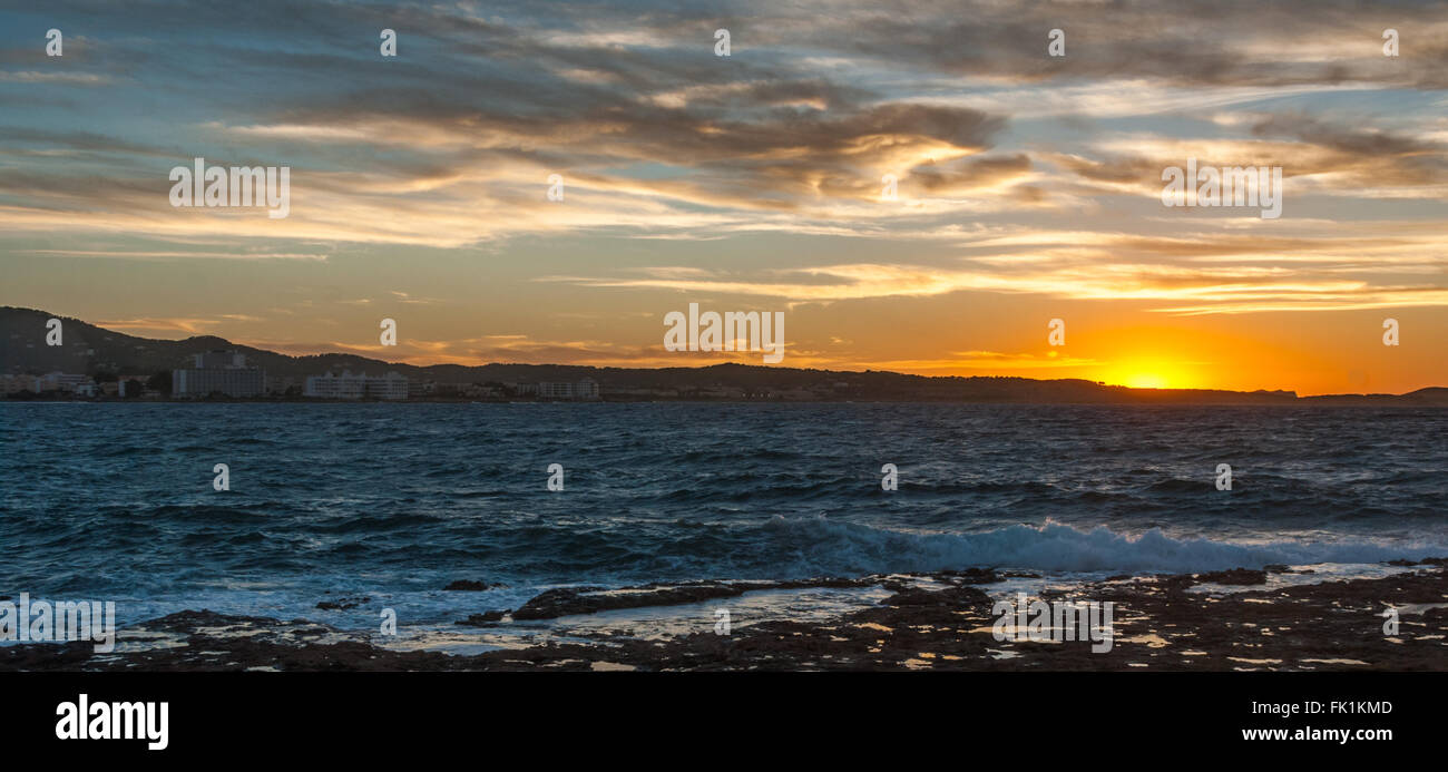 Golden sunset behind Conejera Islands. Choppy waters of Balearic sea ...
