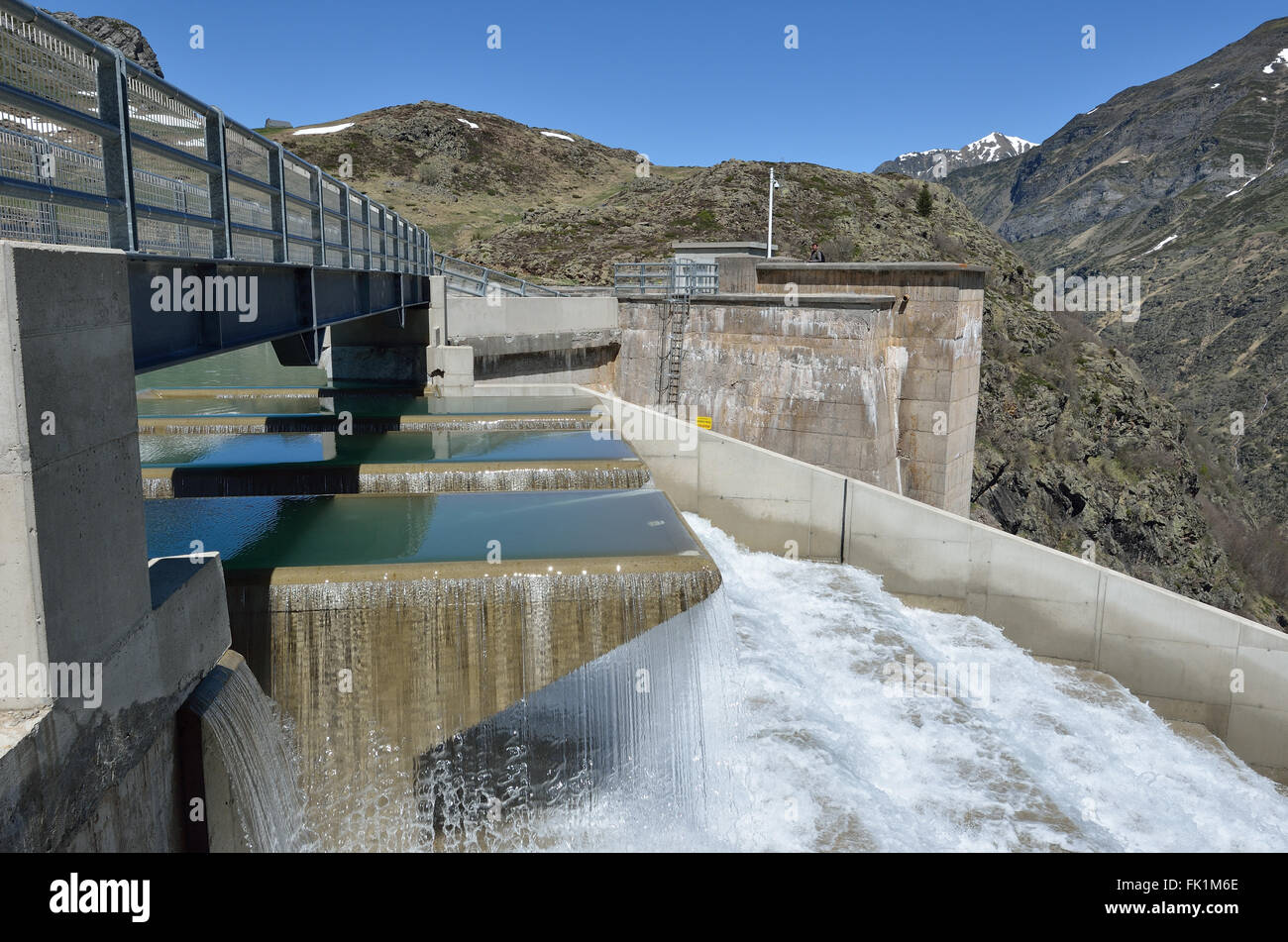 Artificial waterfall of the mountain dam in the French Pyrenees Stock ...