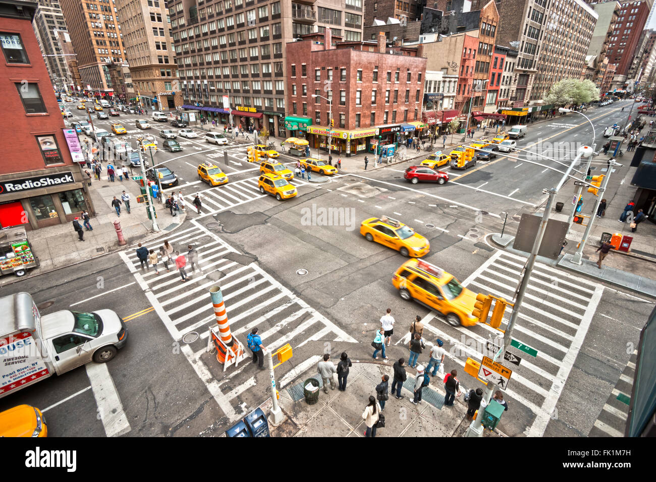 NEW YORK - MARCH 21: City streetlife in point of intersection of 7th Av ...