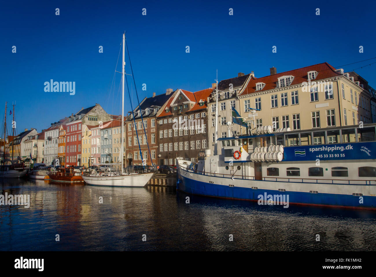 Nyhavn harbour, a popular tourist destination in Copenhagen, Denmark ...