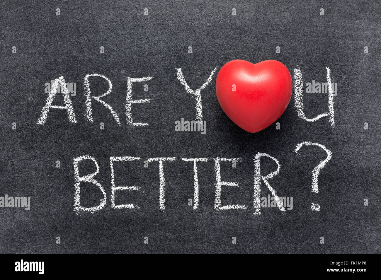 are you better question handwritten on chalkboard with heart symbol ...