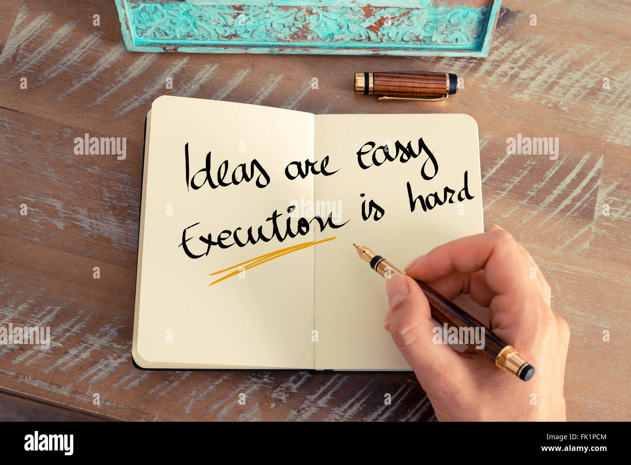 Retro effect and toned image of a woman hand writing a note with a ...