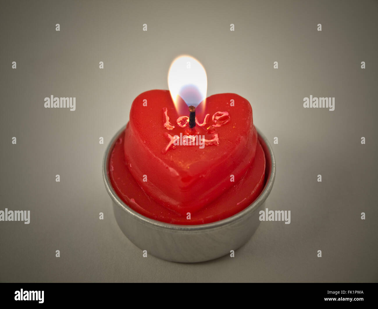Red candle with an inscription, isolated Stock Photo - Alamy