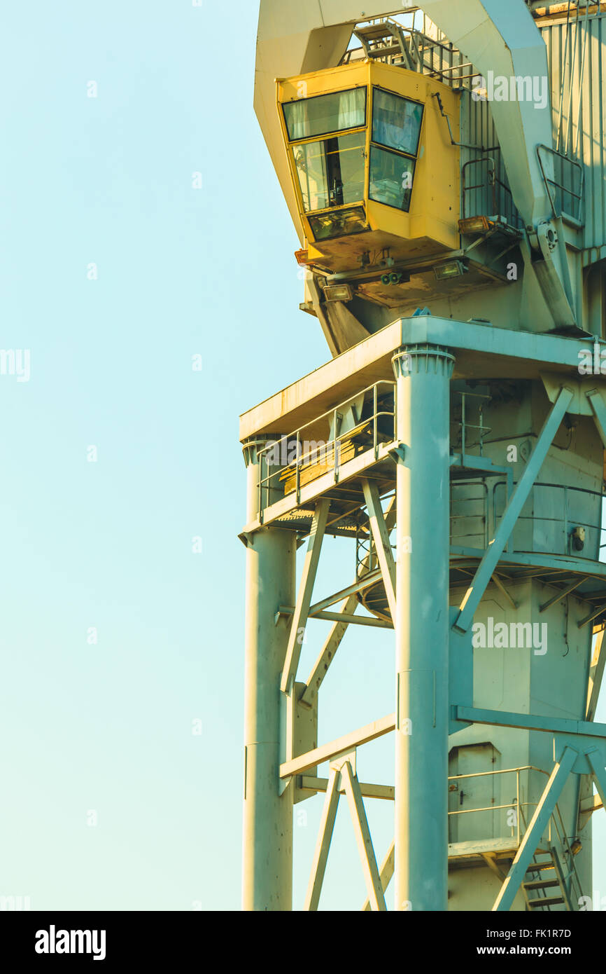 Cockpit of port crane, industry detail. Blue sky background Stock Photo ...