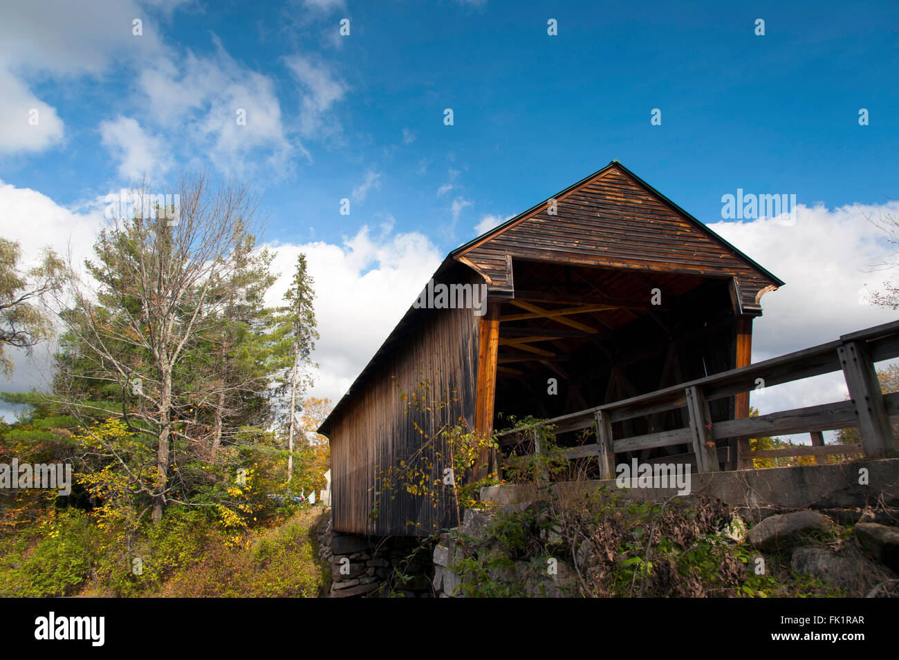 Old weathered wooden covered bridge in late autumn. It is Bement Bridge ...